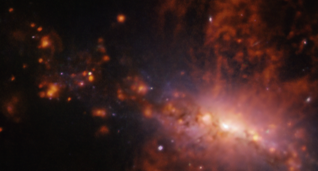 Giant galactic explosion exposes galaxy pollution in action - AGN