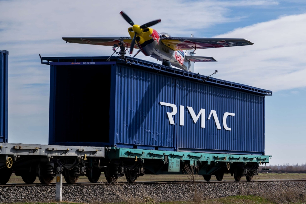 Red Bull pilot lands aircraft on moving train in world-first stunt